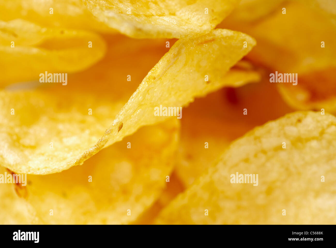 Close up take of fried potato crisps Stock Photo - Alamy