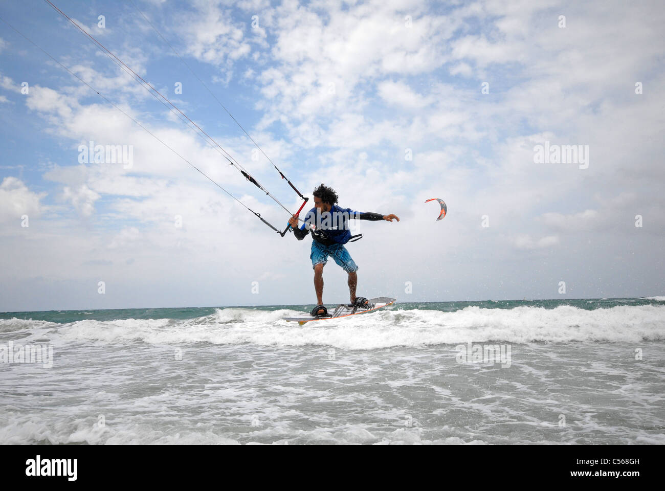 Kite surfer in action jumping Stock Photo - Alamy