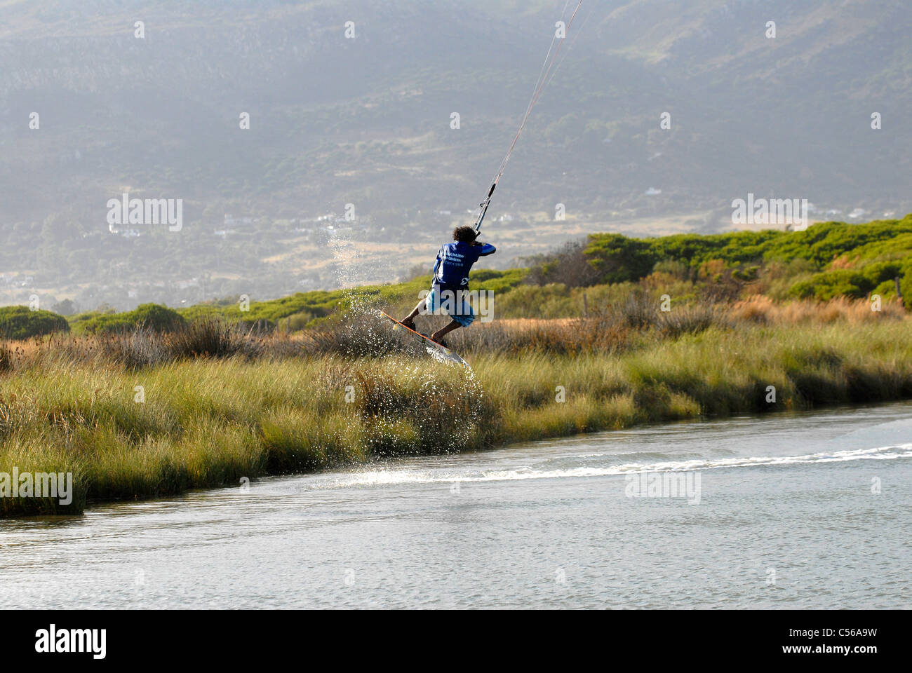 Kite surfer catching air on river in Tarifa Stock Photo - Alamy