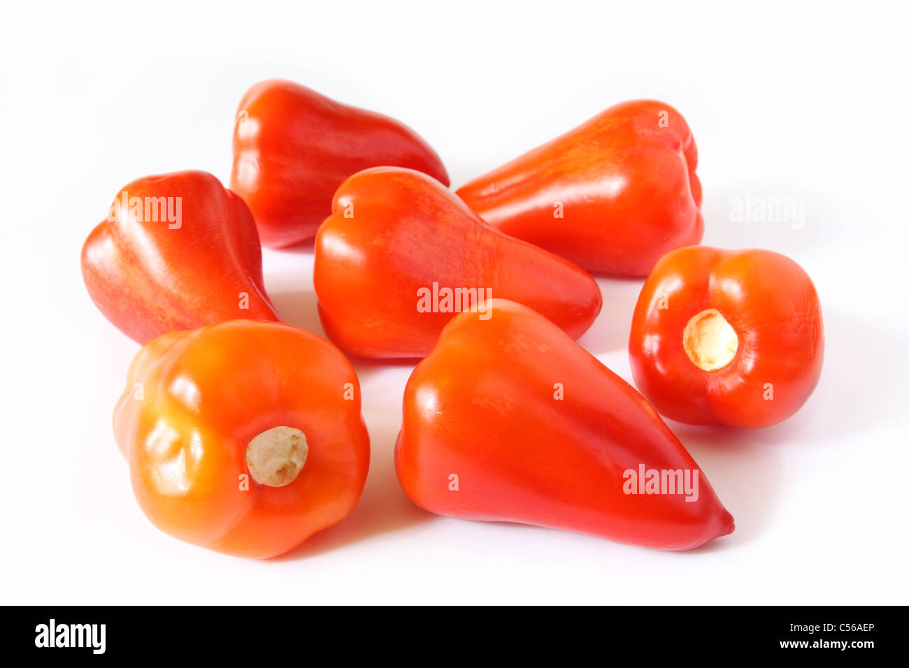Seven salad red pepper on a white background Stock Photo - Alamy