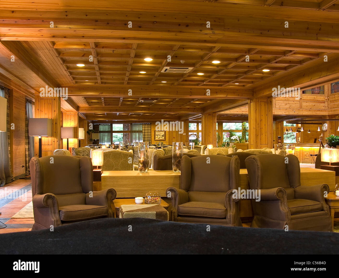 Indoor wooden living room with some chairs Stock Photo - Alamy