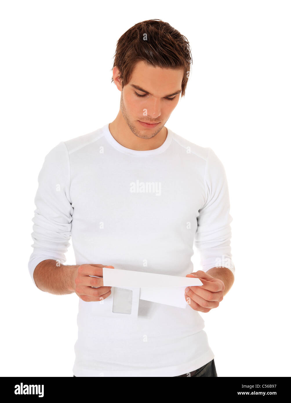 Attractive young man reading a letter. All on white background Stock ...