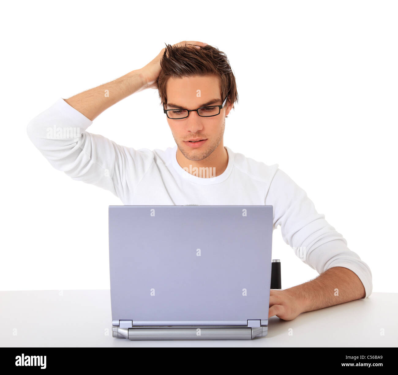 Young guy got a problem with his computer. All on white background ...