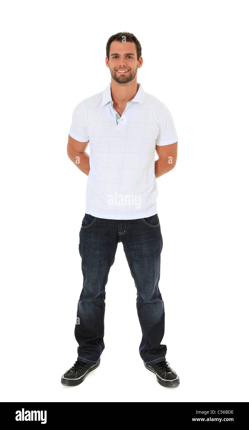 Attractive young man standing in front of plain white background Stock ...