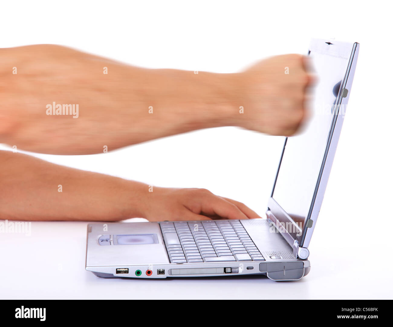 A person punches his laptop. All on white background Stock Photo - Alamy