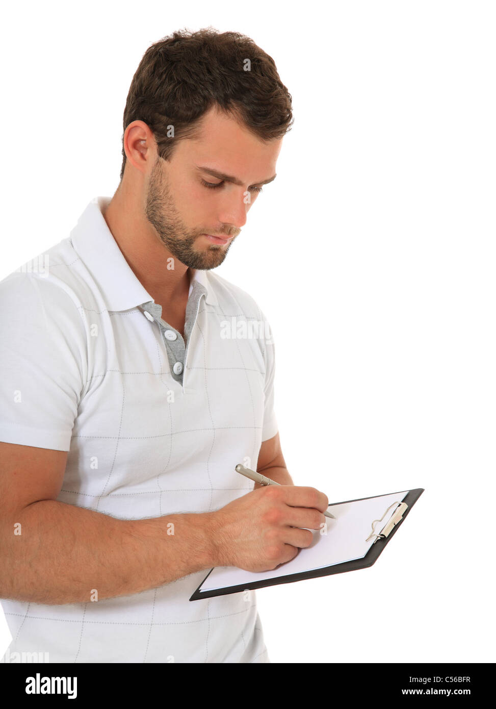Portrait of a young man writing on clipboard. All on white background ...