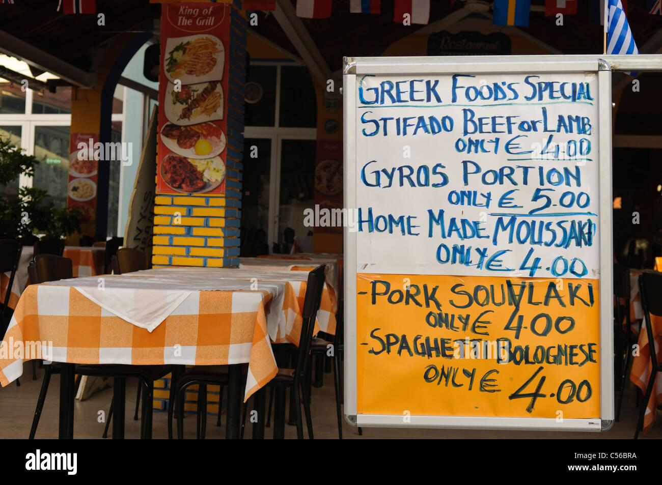 Menu at an empty Greek restaurant Stock Photo - Alamy