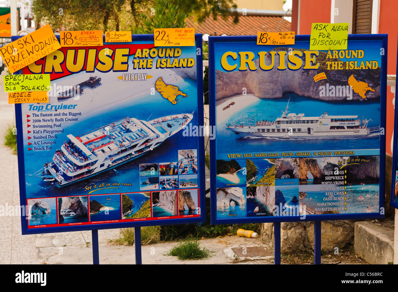 Signs at a tourist shop advertising cruises around Zakynthos Stock ...