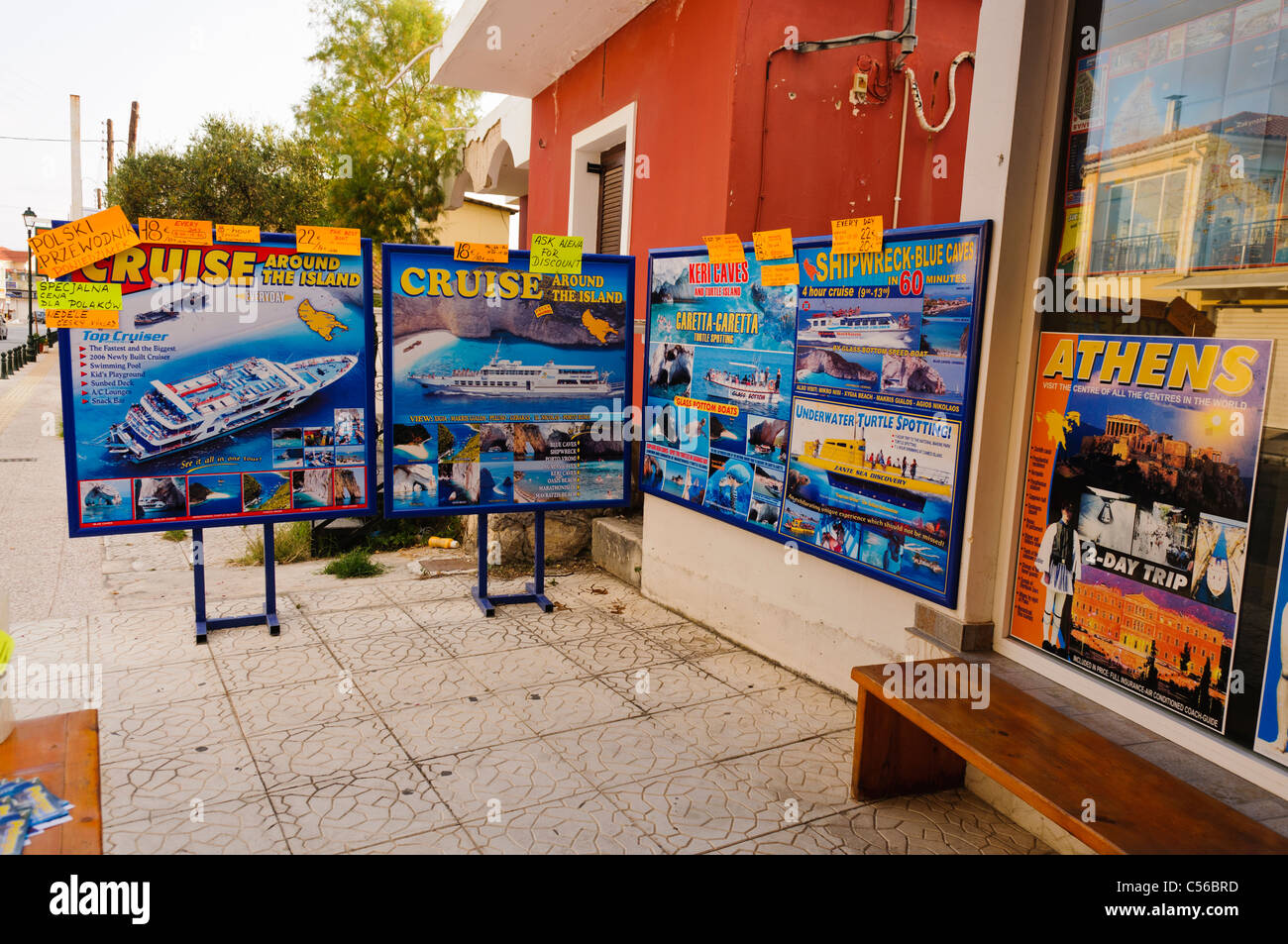 Signs at a tourist shop advertising tours of Zakynthos and cultural ...