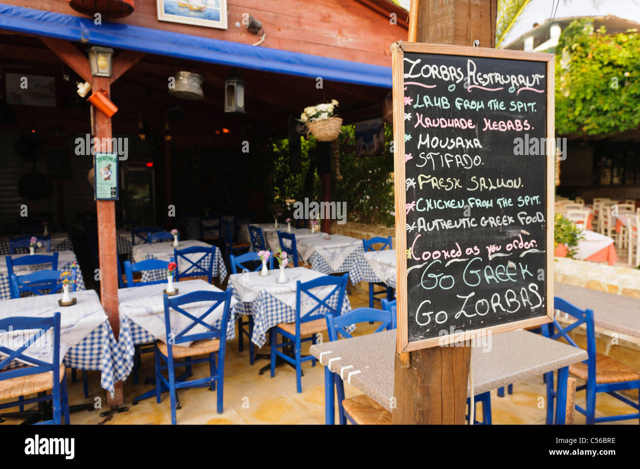Menu at an empty Greek restaurant Stock Photo - Alamy