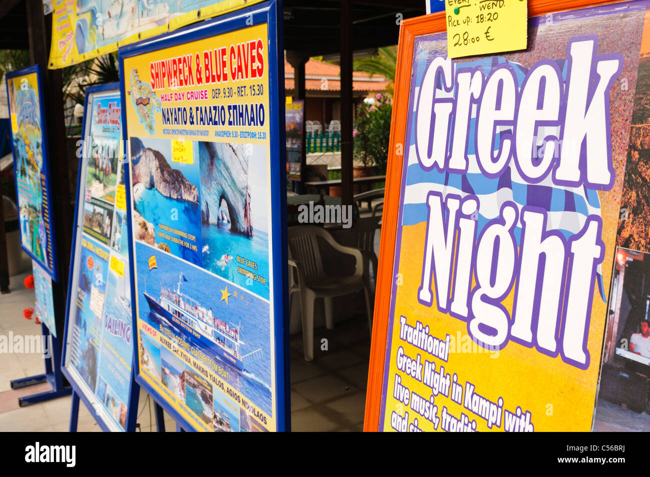 Signs at a tourist shop advertising tours of Zakynthos and cultural ...
