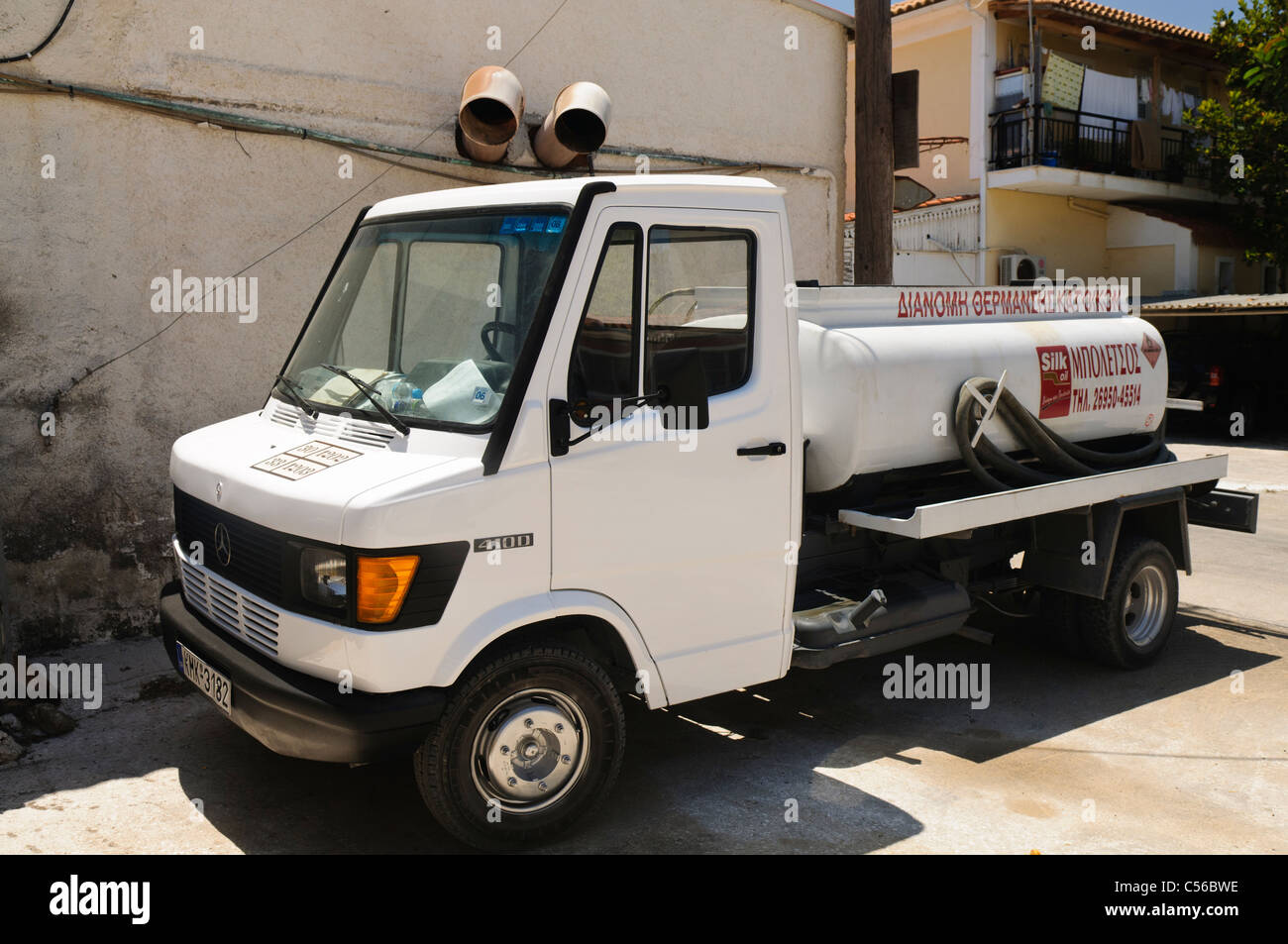 Very small petrol tanker Stock Photo - Alamy