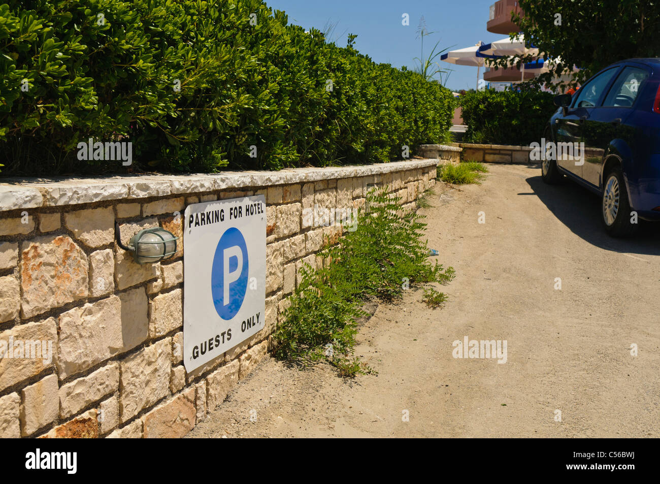 Bilingual (English and Greek) no parking sign "Parking For Hotel Stock ...