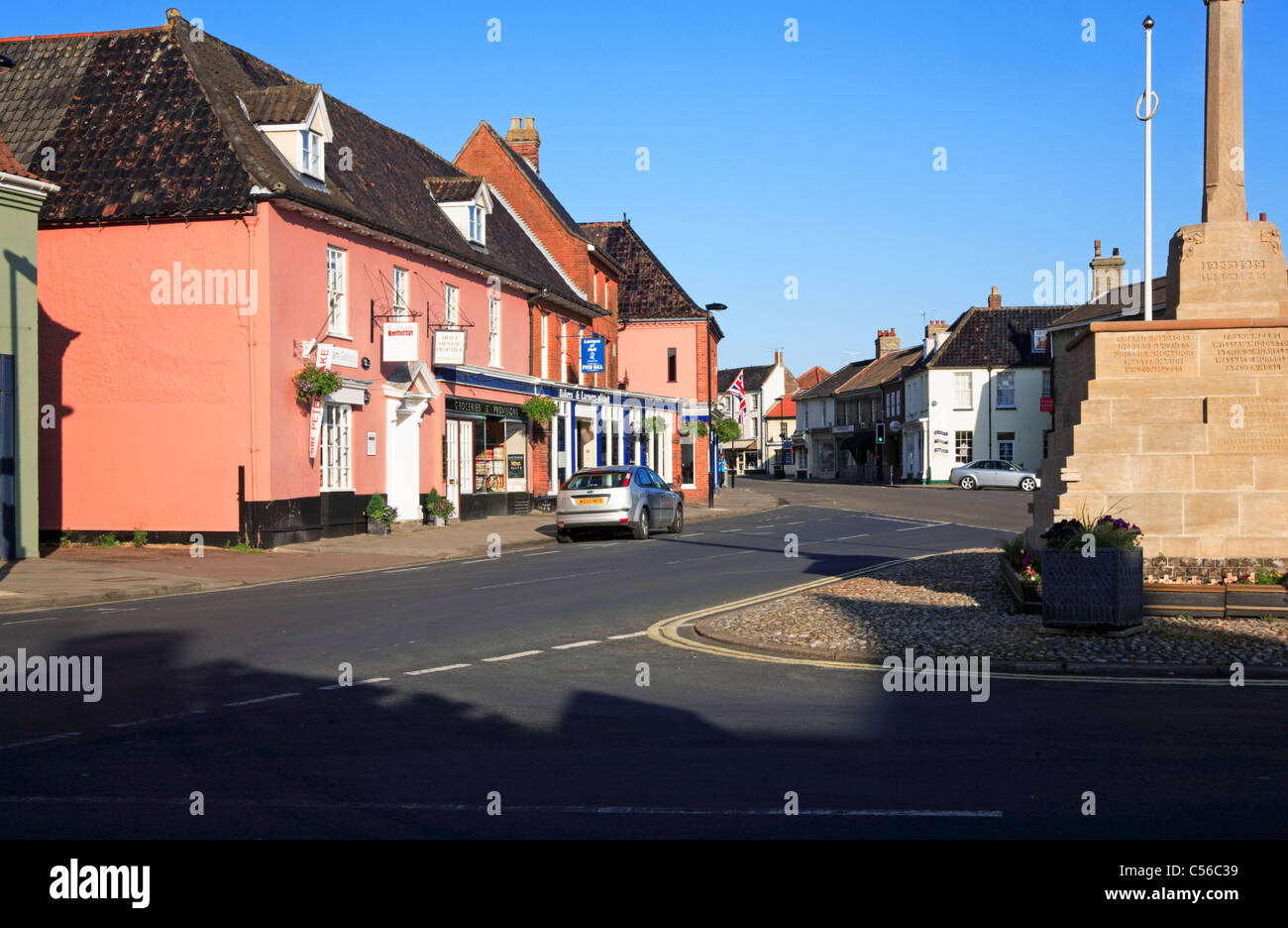 A view of a corner of the market place by the war memorial at Holt ...