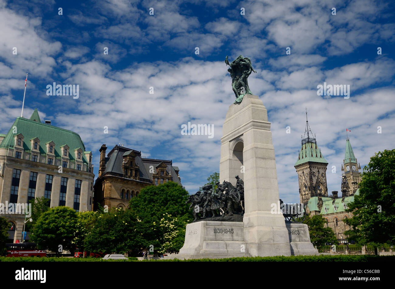 National War Memorial in Confederation Square in downtown Ottawa with Parliament Buildings ...