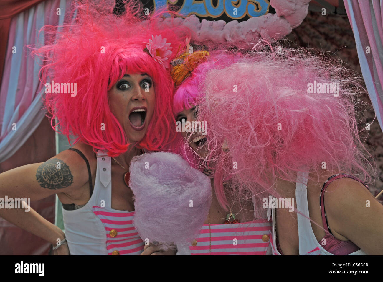 Ladies called the Candy Queens wearing pink hair wigs making and ...
