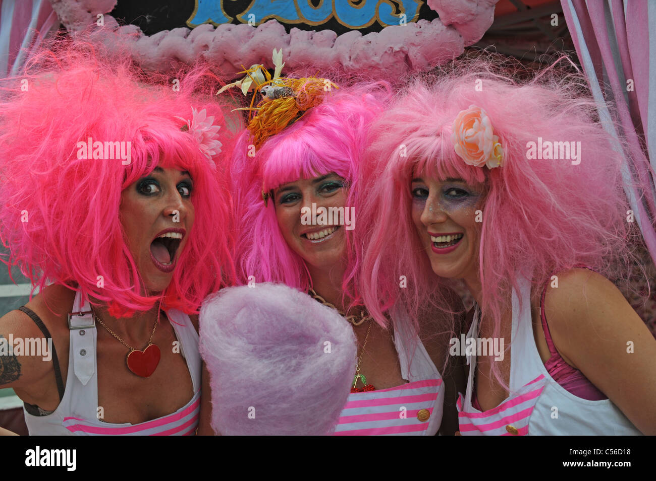 Ladies called the Candy Queens wearing pink hair wigs making and ...