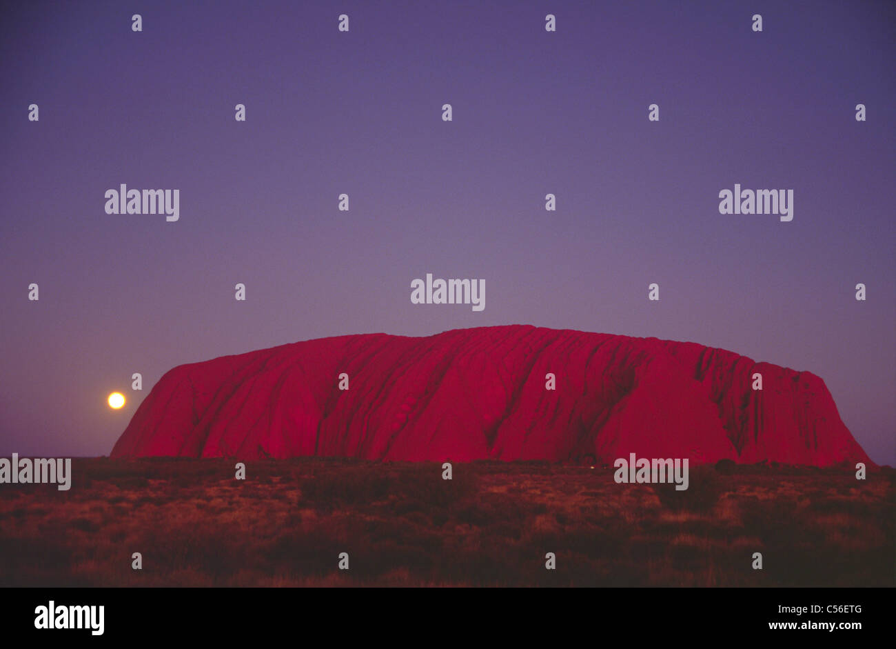 Uluru sunset with moon, Australia Stock Photo - Alamy