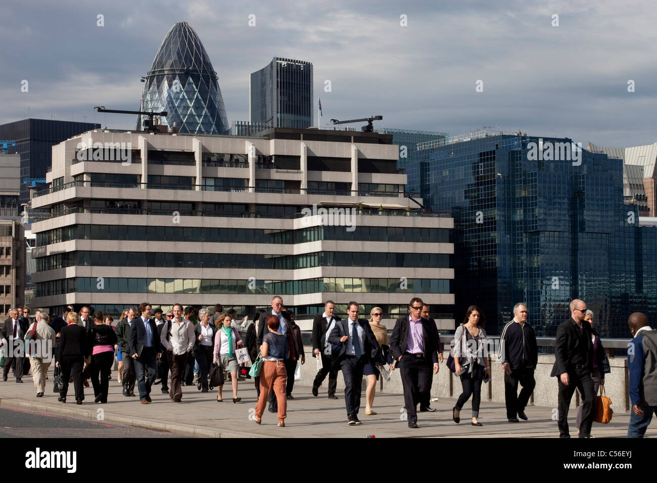 Commuters crossing London Bridge on their way home, London, England ...