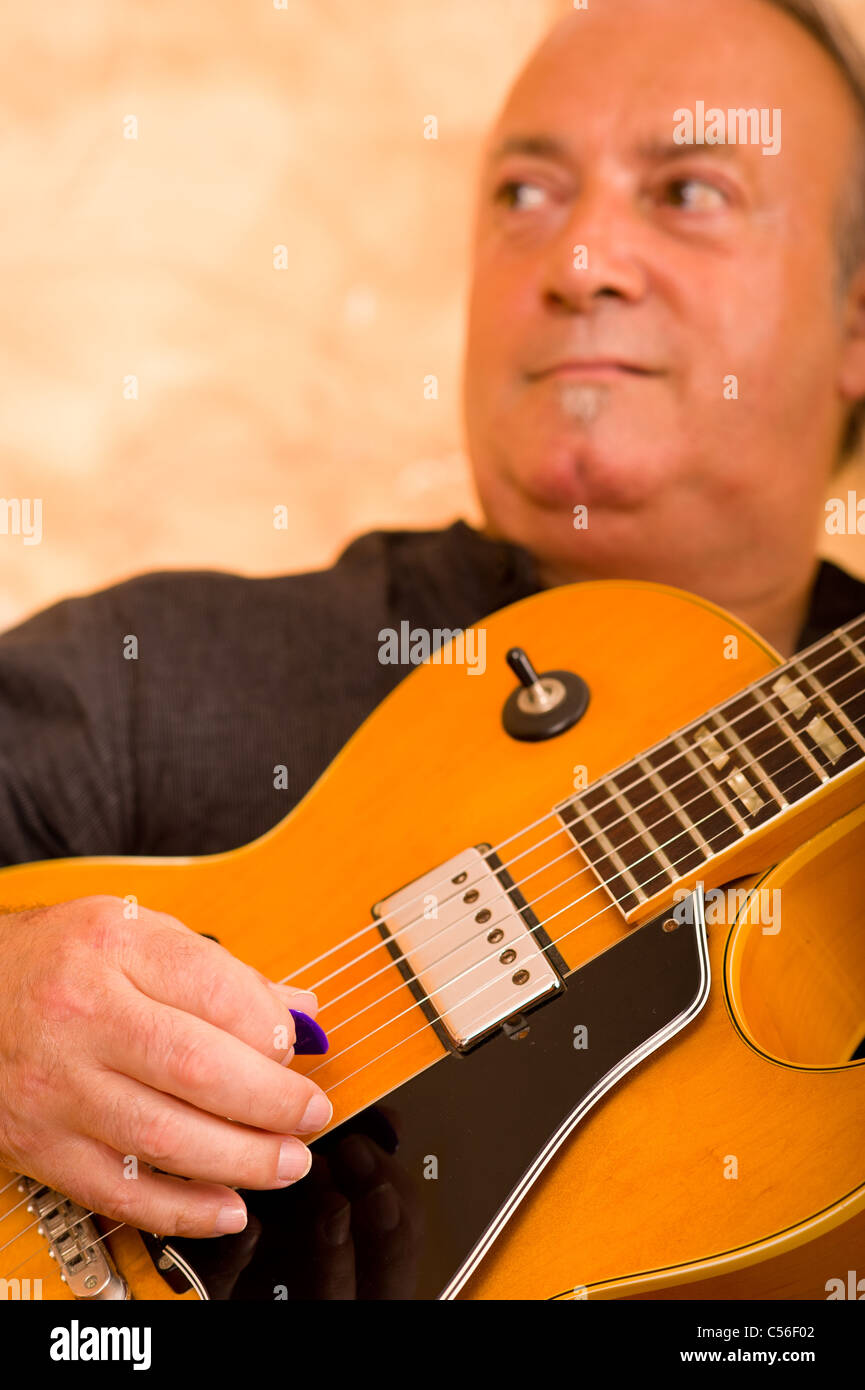 Jazz guitarist in action playing on stage Stock Photo - Alamy