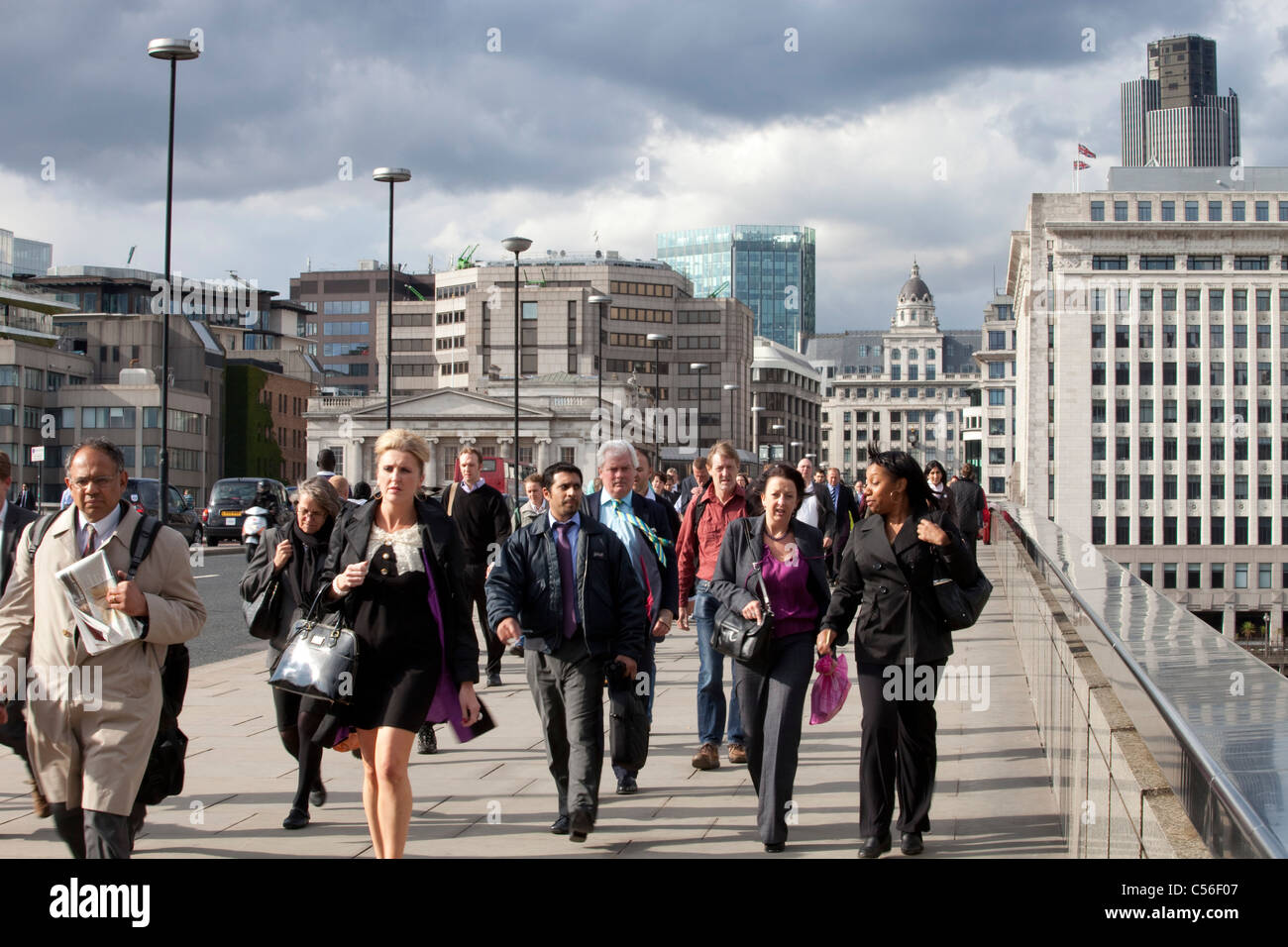 Commuters crossing London Bridge on their way home, London, England ...