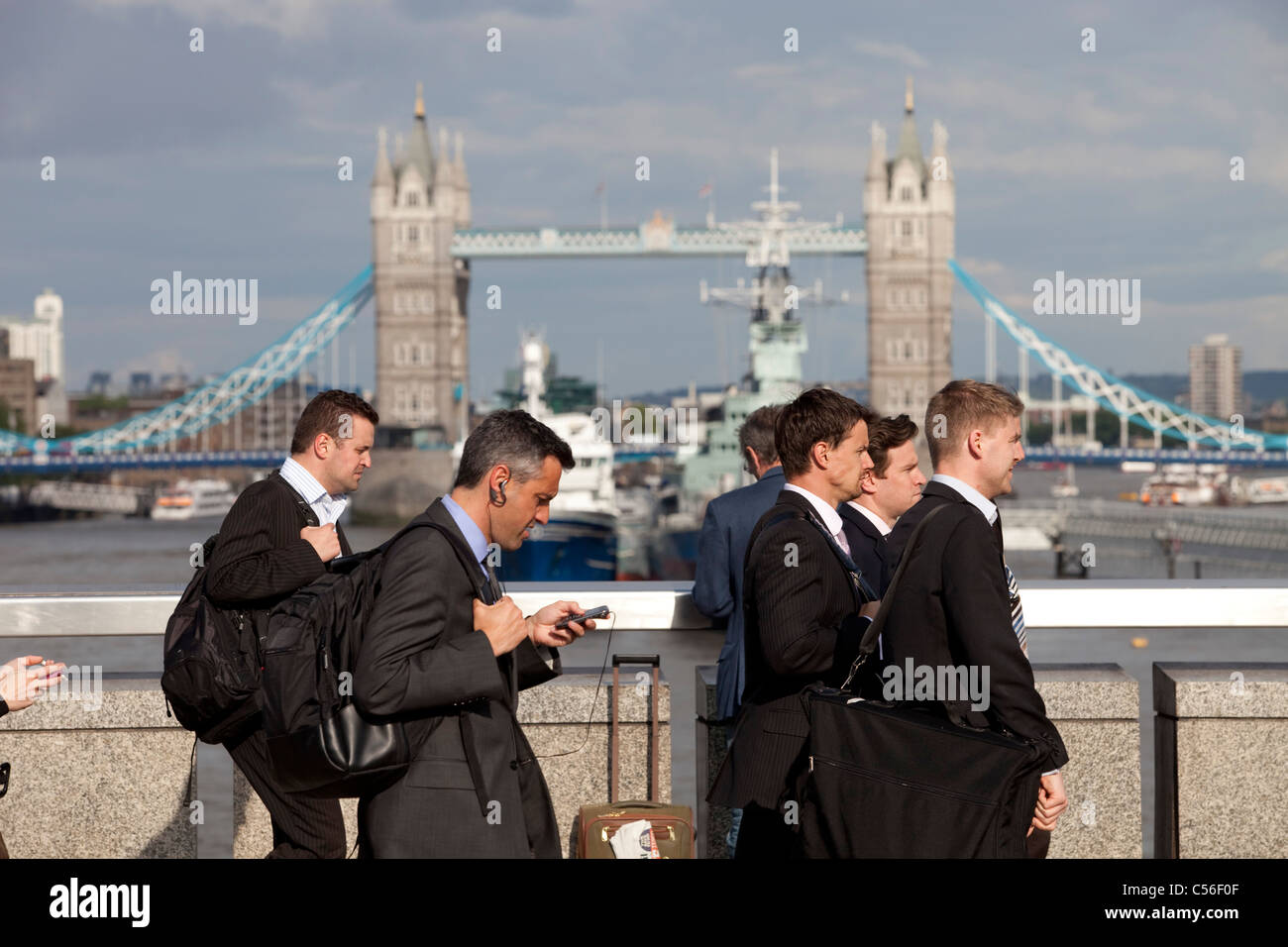 Commuters crossing London Bridge on their way home, London, England ...