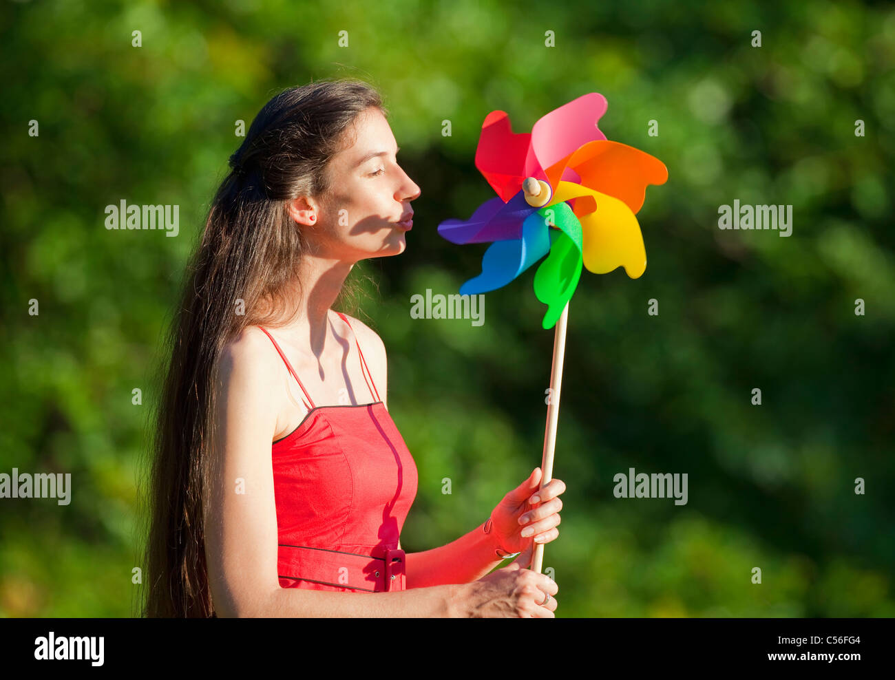 Girl with a pinwheel hi-res stock photography and images - Alamy