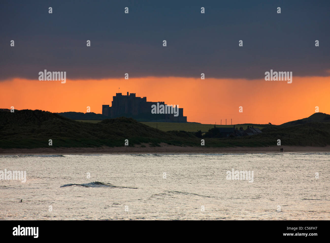 Bambourgh Castle at sunset looking north Stock Photo - Alamy