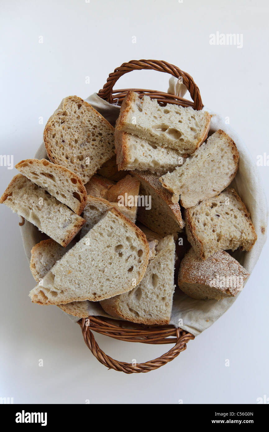 A bread basket filled with a selection of freshly cut bread Stock Photo ...