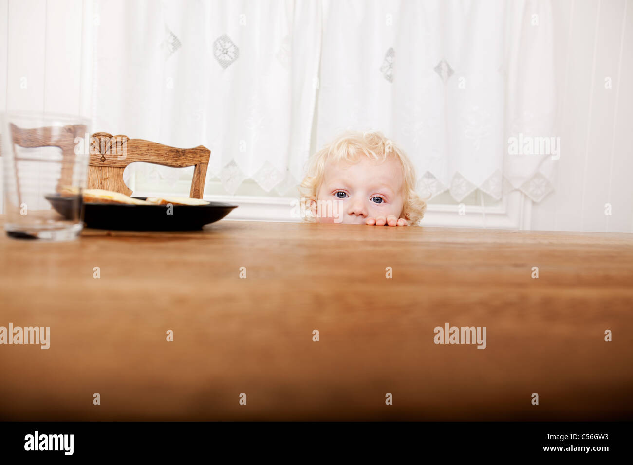 Child Peeking Over Table High Resolution Stock Photography and Images ...
