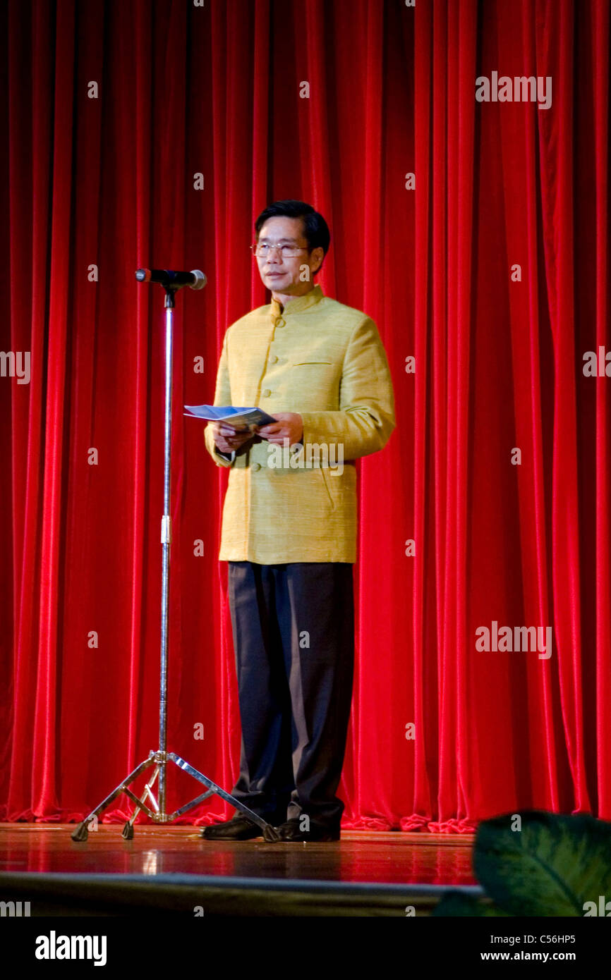 The communist Vientiane city mayor is speaking on stage during a show ...