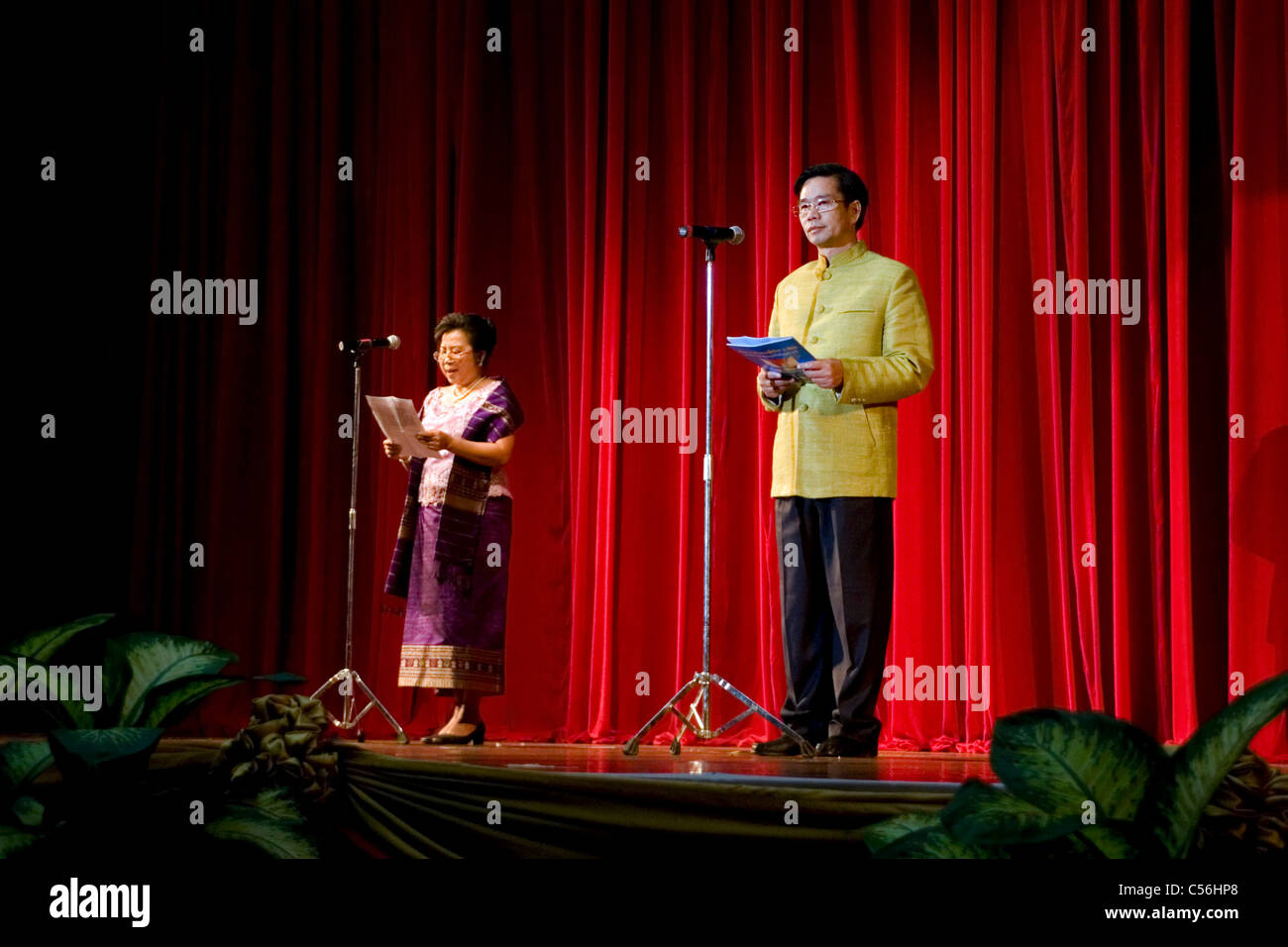 The communist Vientiane city mayor is speaking on stage during a show ...