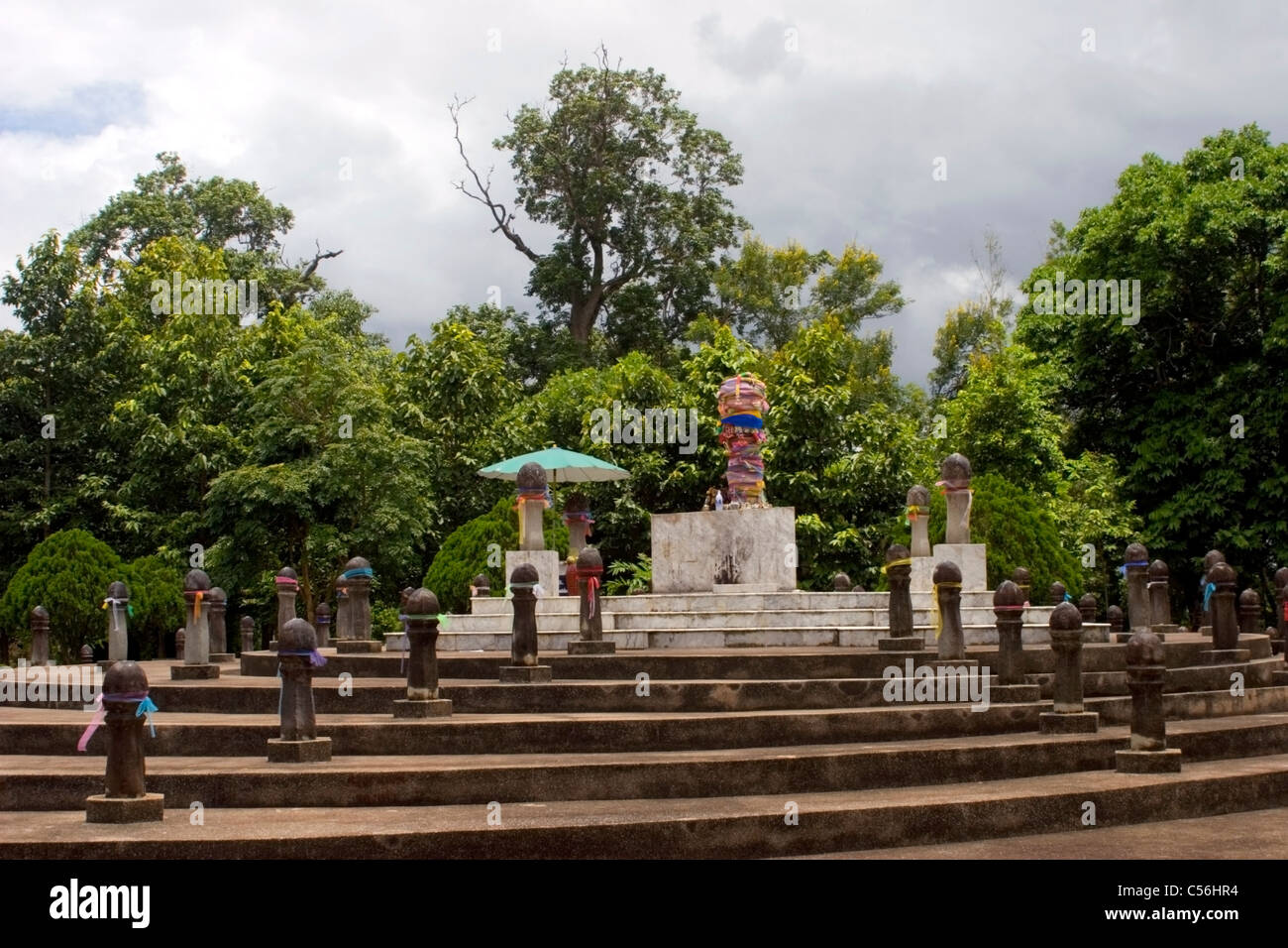 Bright and colorful ribbons are tied to posts on the grounds of a ...