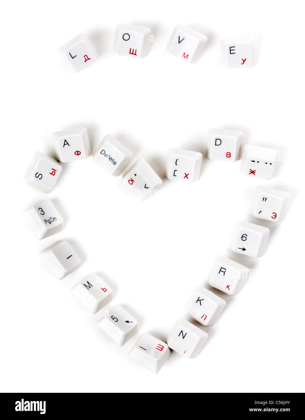 word love and the heart laid out keys from the keyboard on a white ...