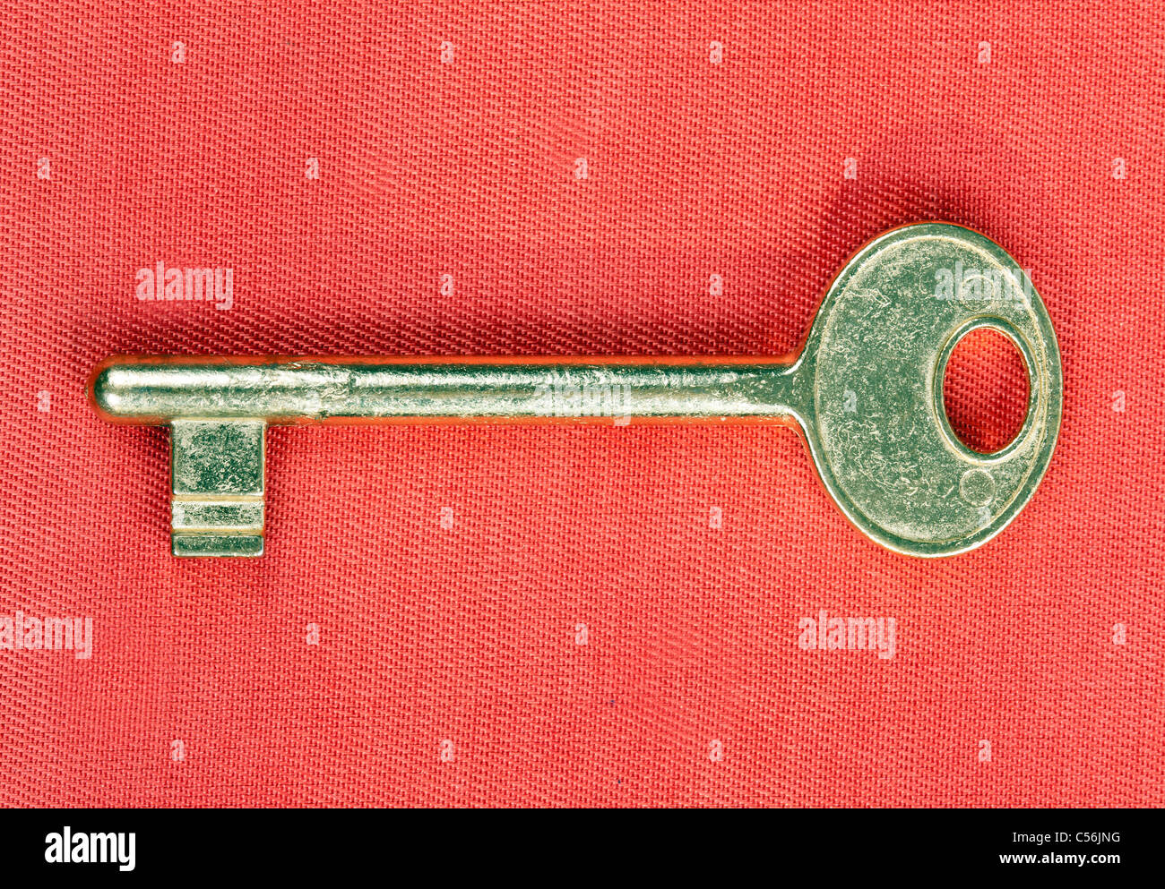 old golden key to the door isolated on white background Stock Photo - Alamy