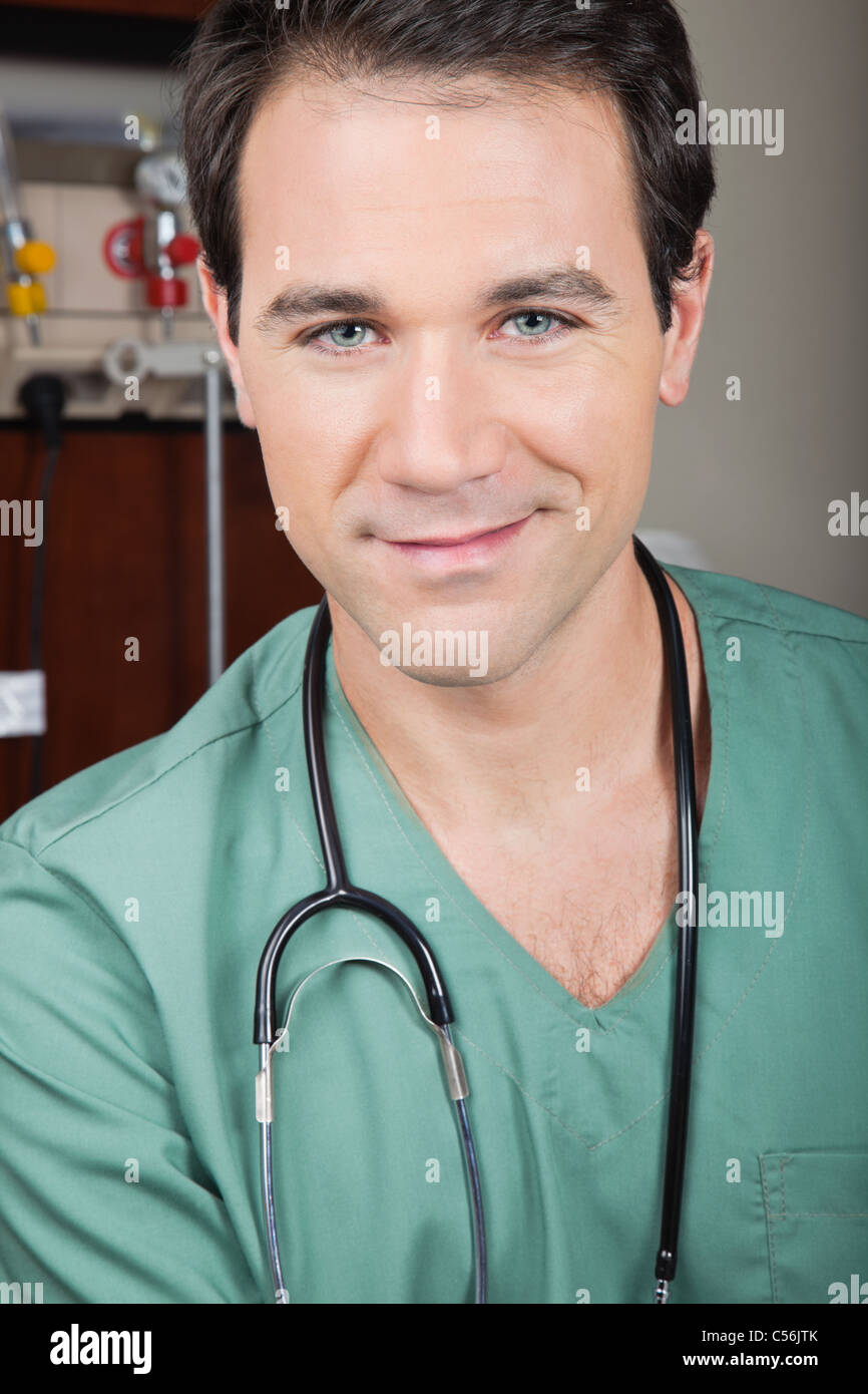Portrait of handsome male surgeon smiling Stock Photo - Alamy
