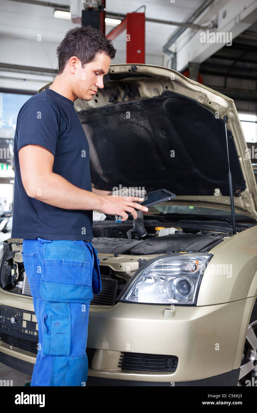 Vertical mechanic working on engine hi-res stock photography and images ...
