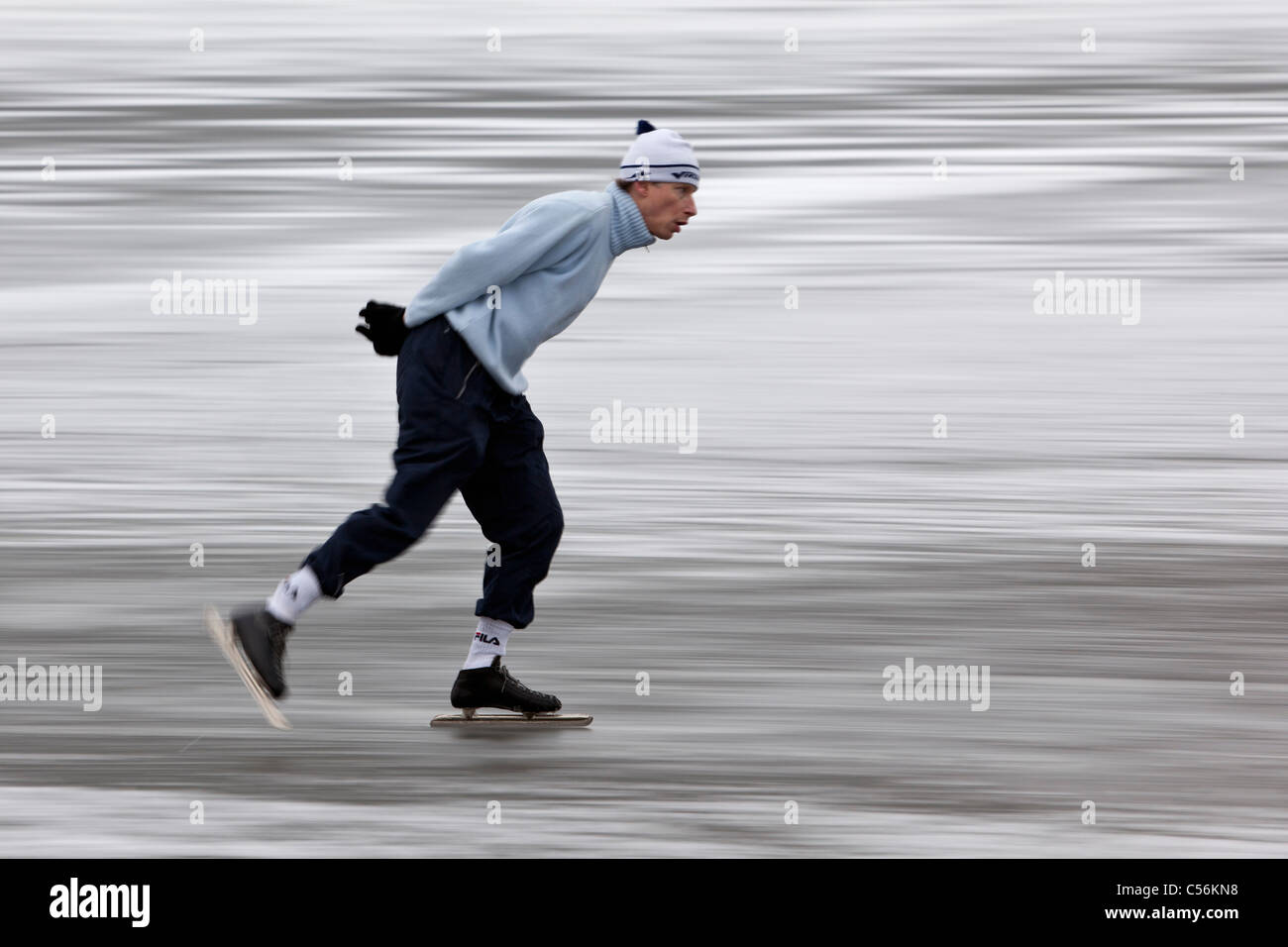 The Netherlands, Ankeveen. Man ice skating. Motion blurred Stock Photo ...