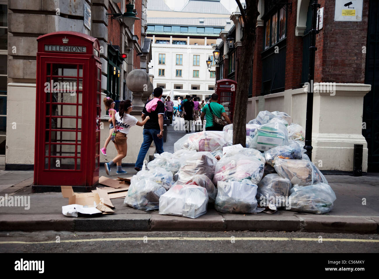 Rubbish bags piled high awaiting collection in central London Stock ...