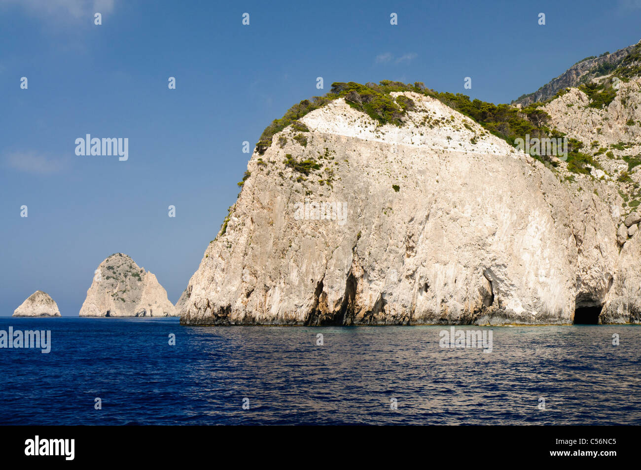 Caves along the limestone coastal cliffs of the Greek island Zante ...