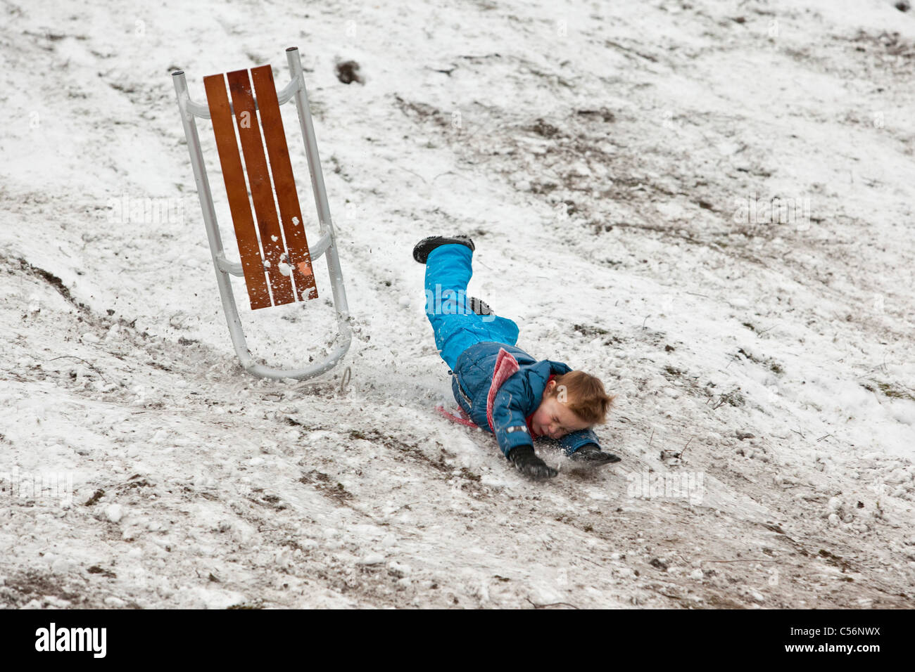 Boy falling sledge motion winter hi-res stock photography and images ...