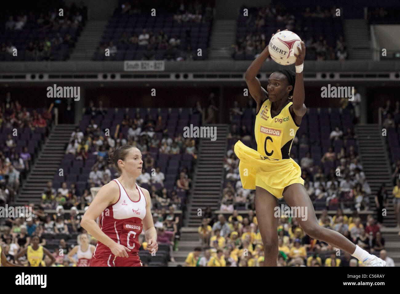 10.07.2011 Paula Thompson of Jamaica(right) get to the ball as Karen ...