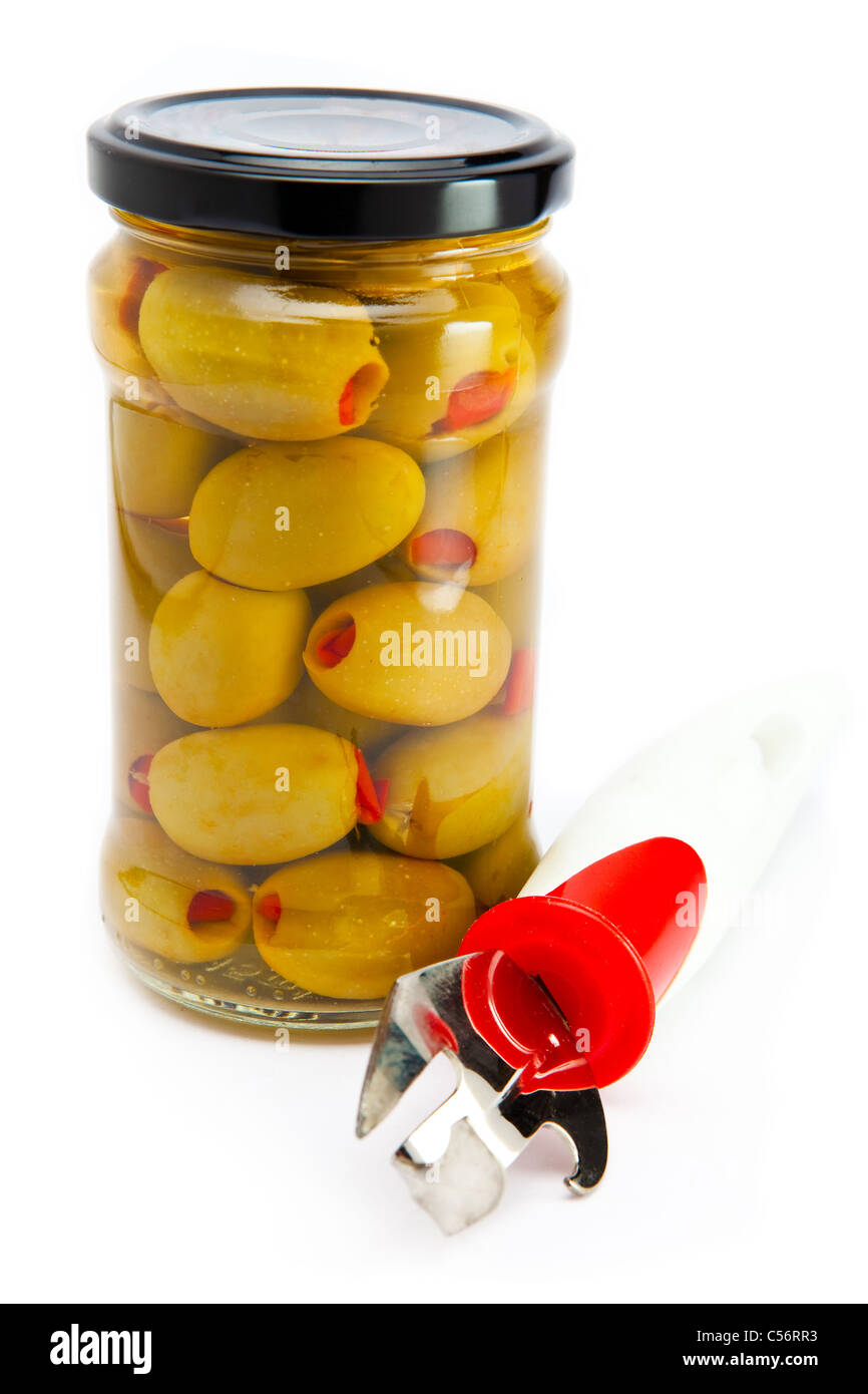 Glass jar with tinned olives And a can opener Stock Photo - Alamy
