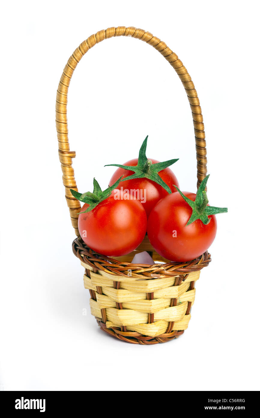 Basket full red tomatoes Cut Out Stock Images & Pictures - Alamy