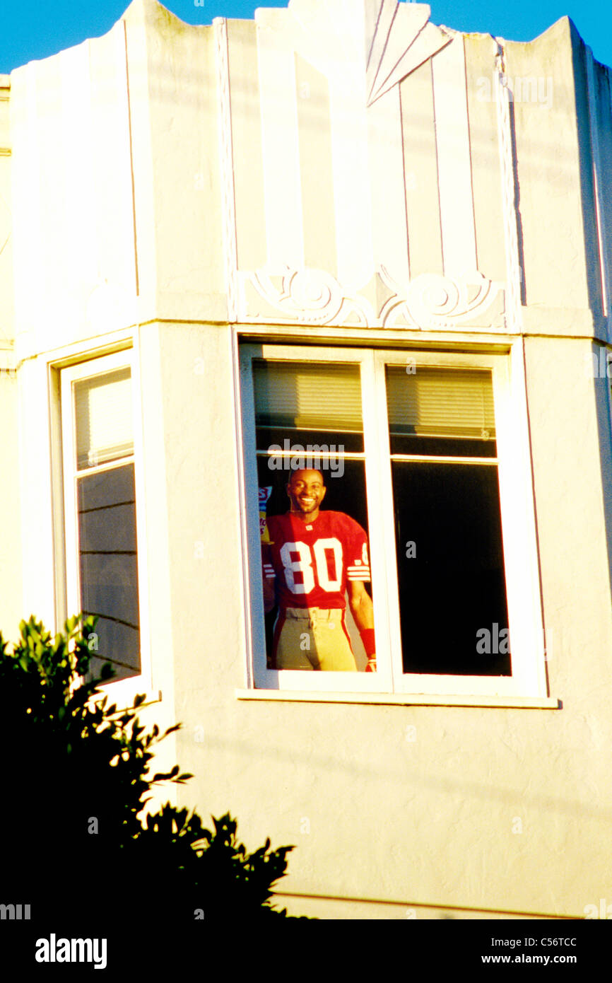 cardboard display of Jerry rice selling lays potato chips in window of ...