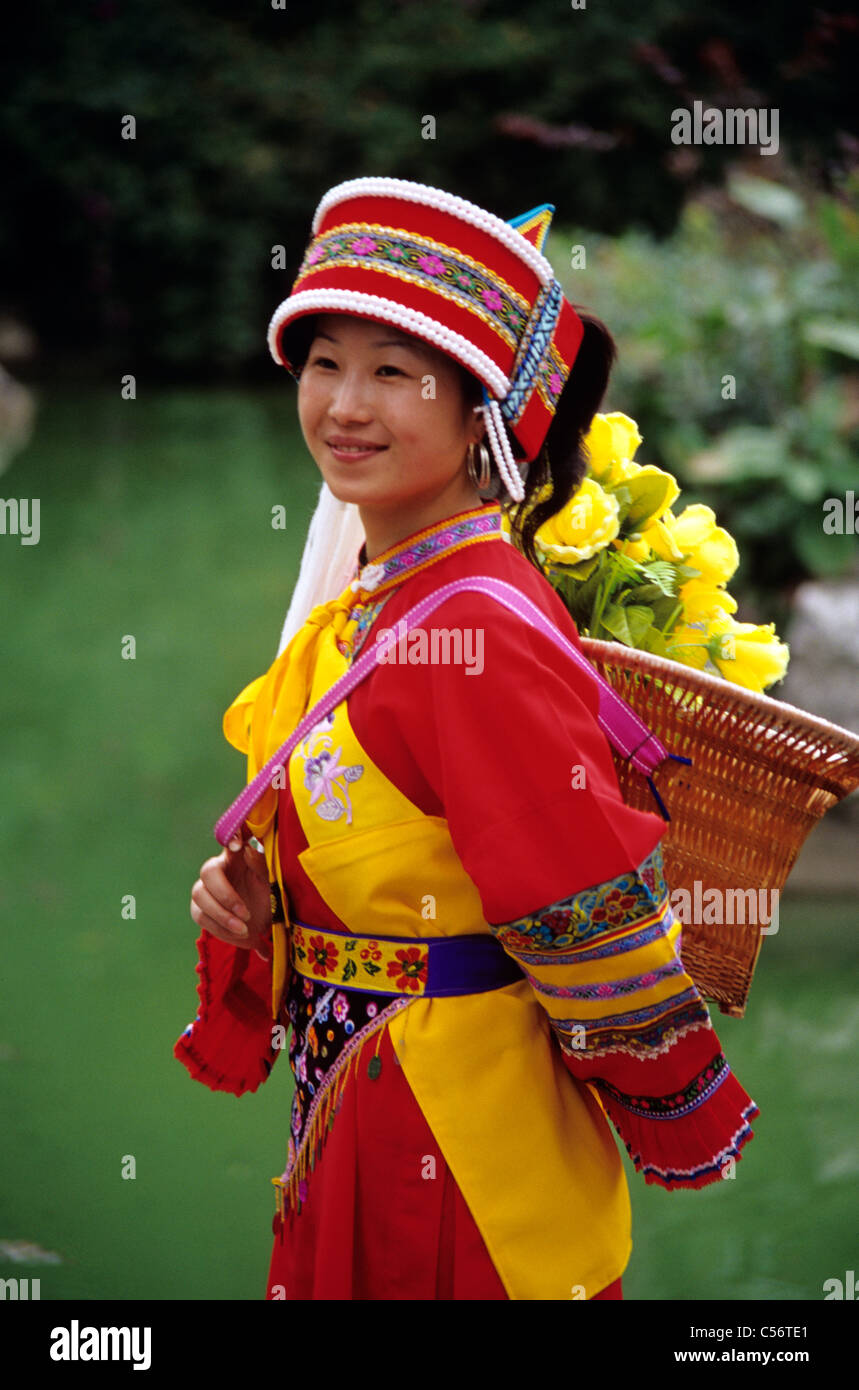 chinese native minority woman poses at stone forest in Kumming Stock ...