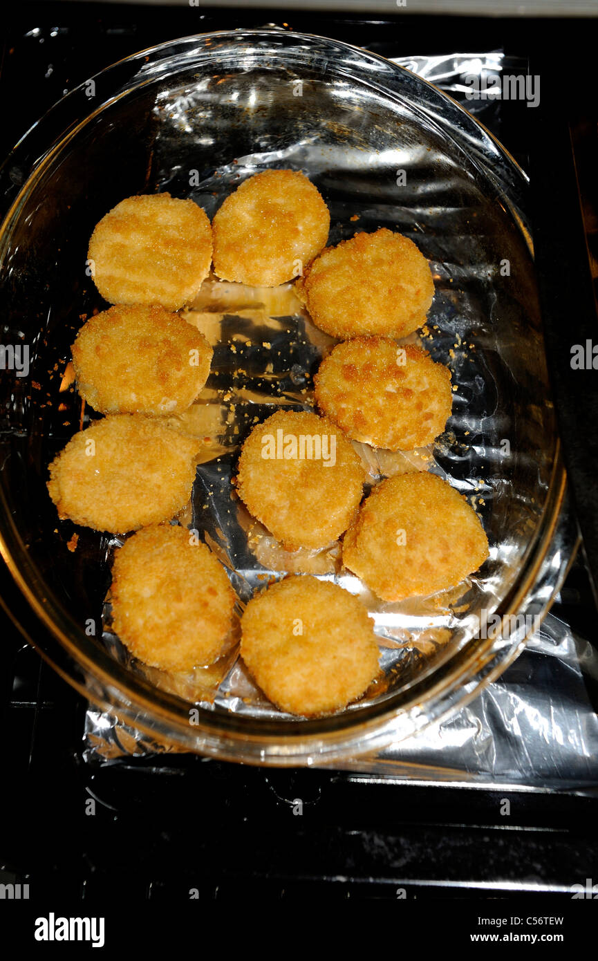 chicken nuggets cooking in the oven Stock Photo - Alamy