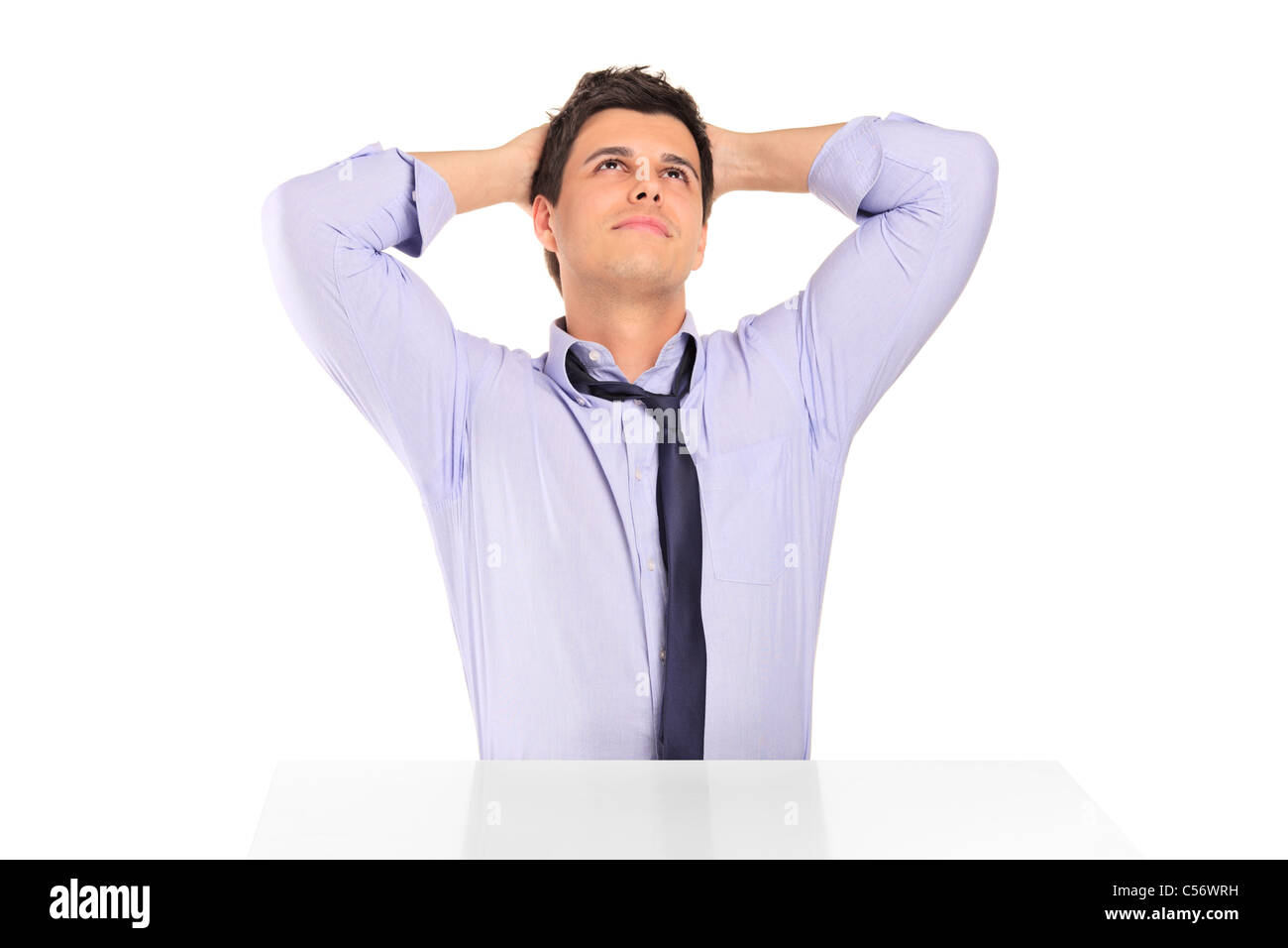 A young satisfied businessman looking above Stock Photo - Alamy