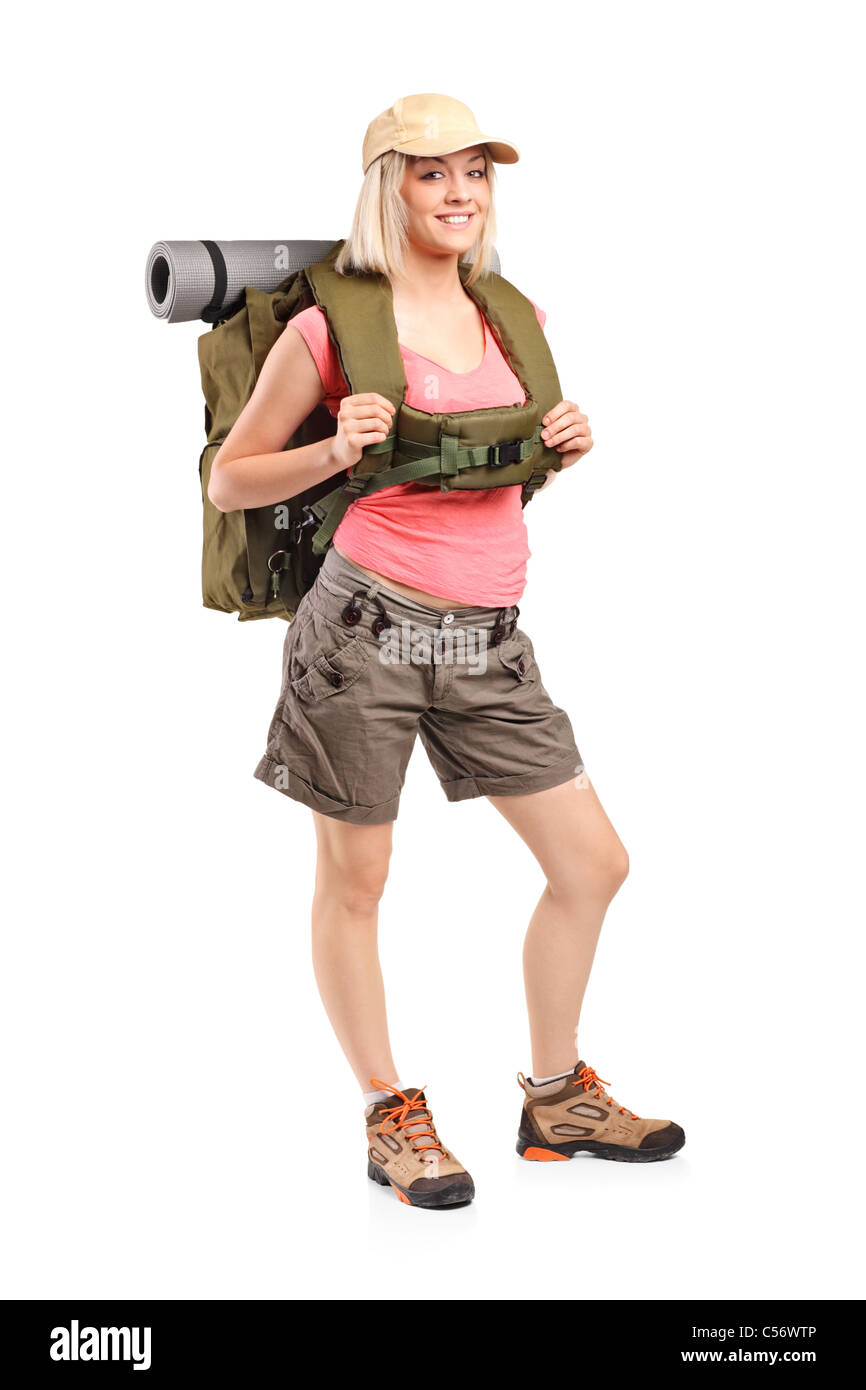 Full length portrait of a woman in sportswear with backpack posing ...