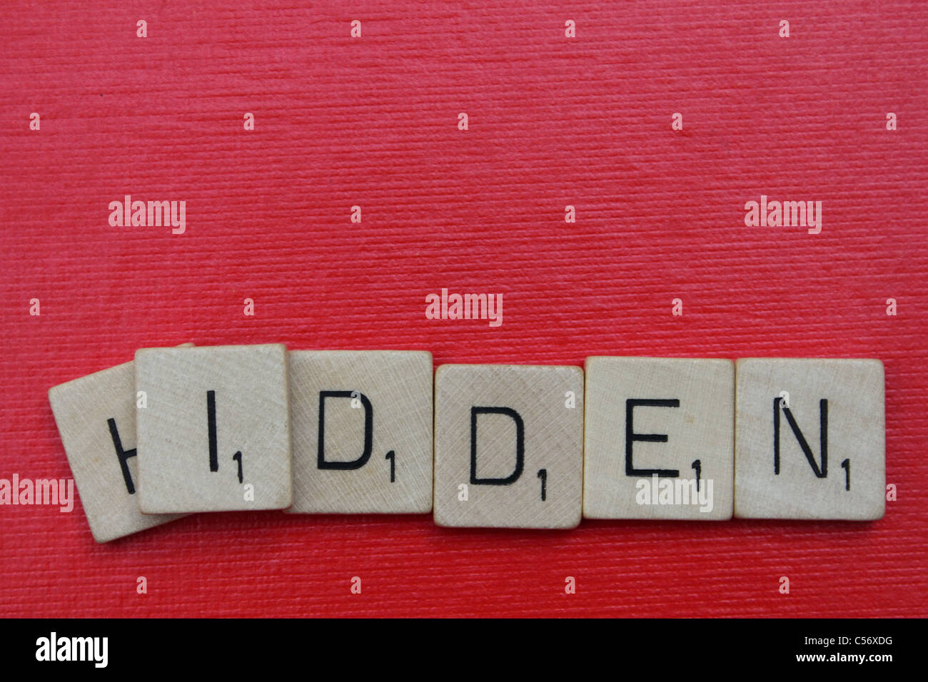 letters forming the word HIDDEN, the letter H being hidden under the I ...